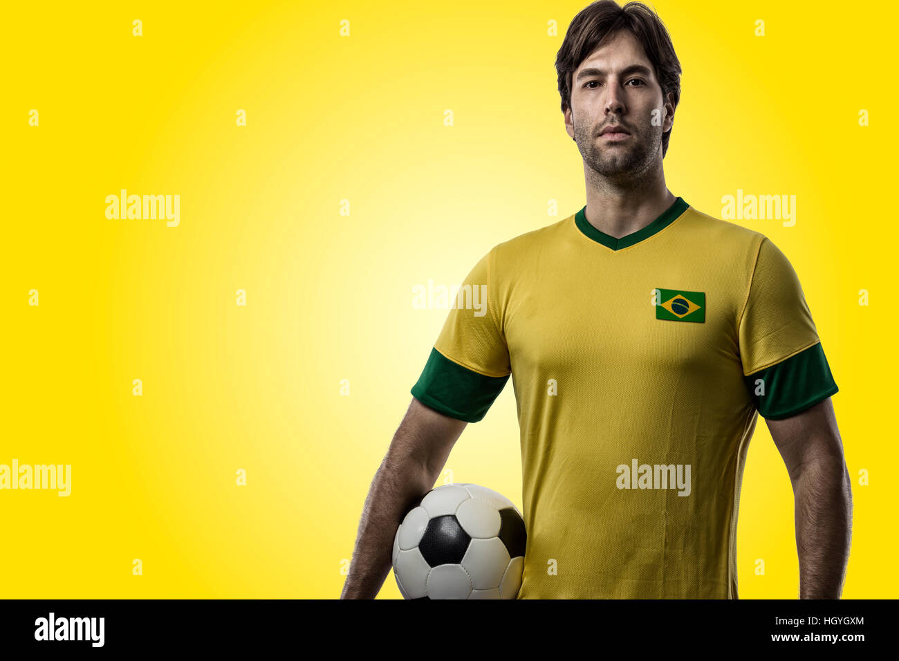 Brazilian soccer player, celebrating on a yellow background Stock Photo ...