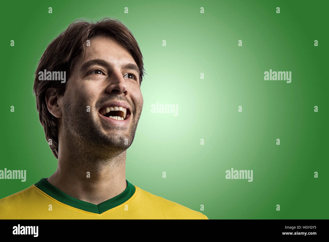 Brazilian soccer player, celebrating on a green background Stock Photo ...