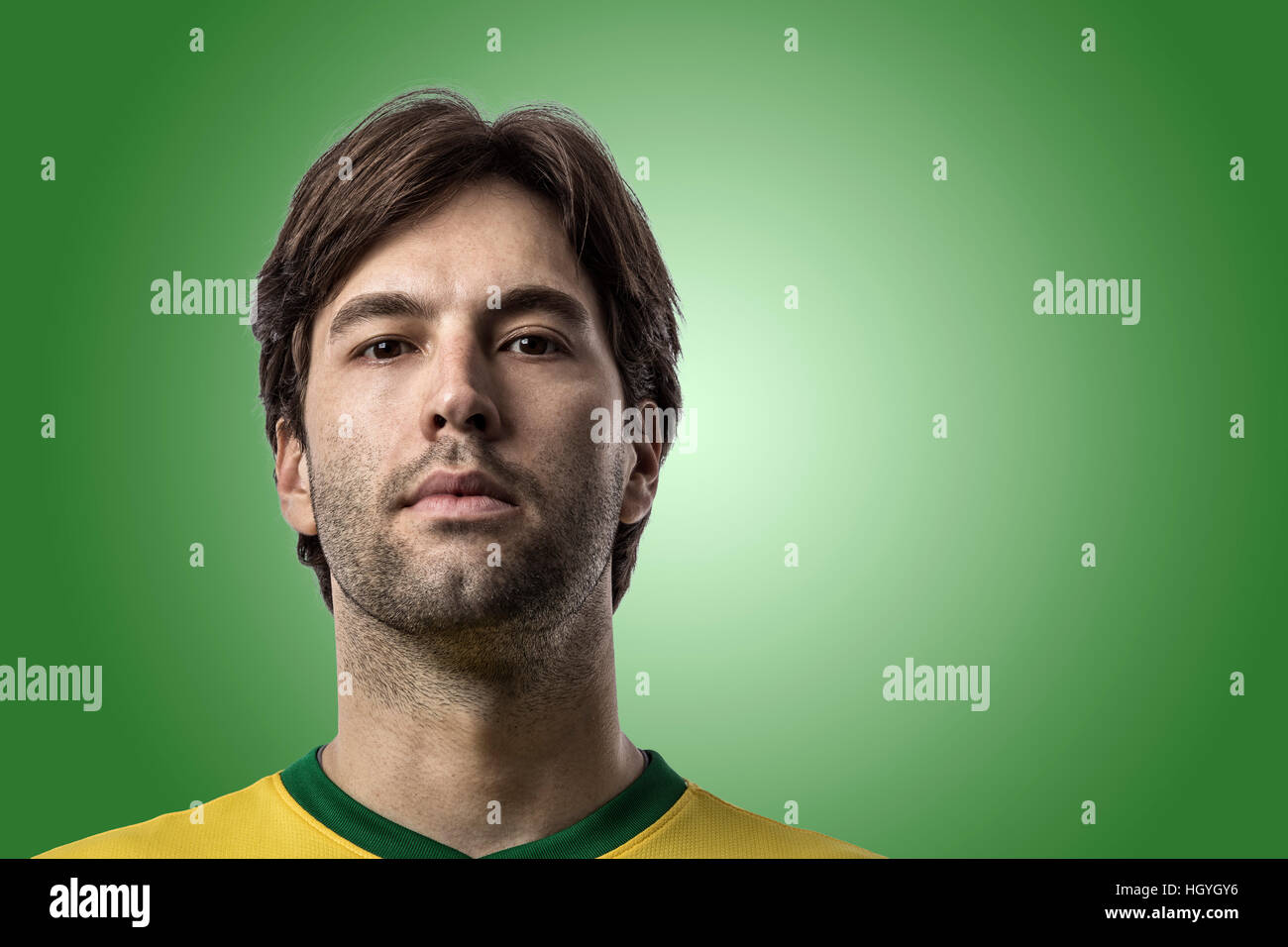 Brazilian soccer player, celebrating on a green background Stock Photo ...