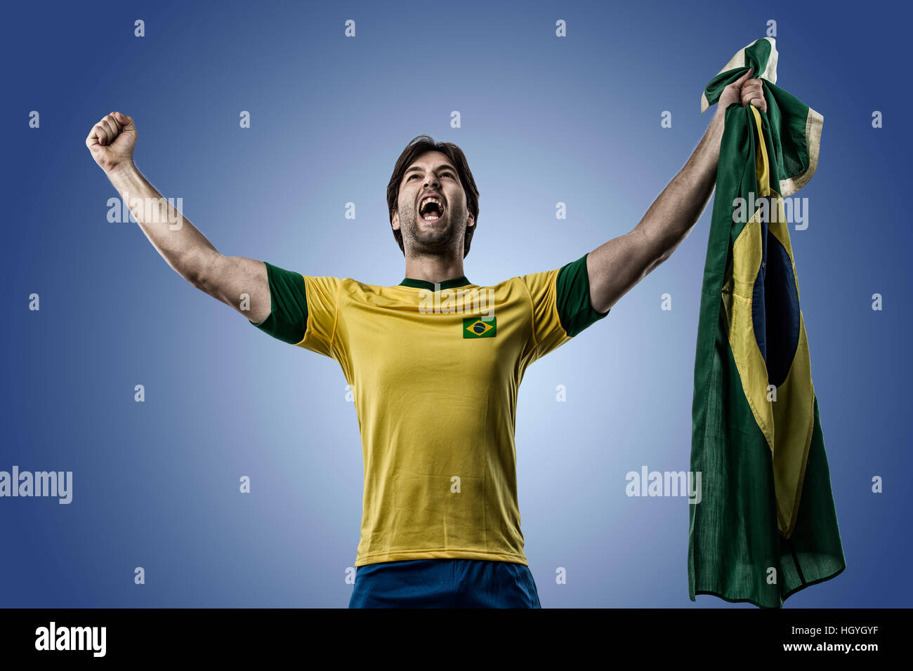 Brazilian soccer player, celebrating on a blue background Stock Photo ...