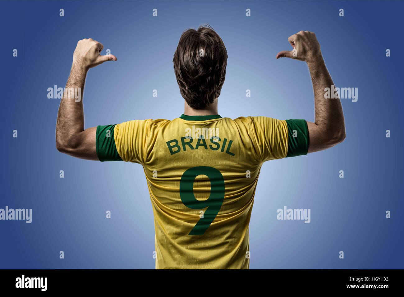 Brazilian soccer player, celebrating on a blue background Stock Photo ...