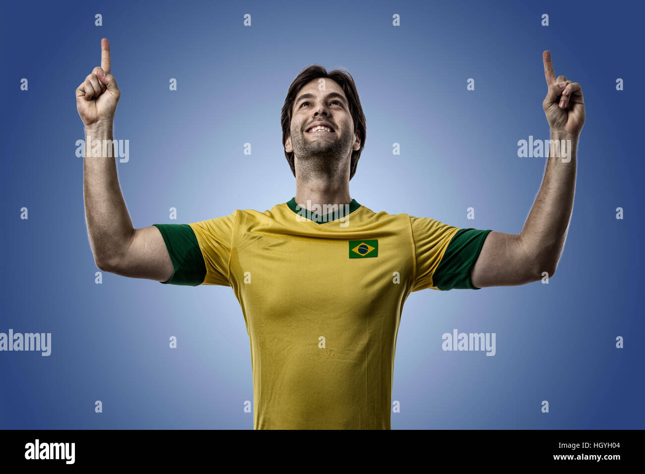 Brazilian soccer player, celebrating on a blue background Stock Photo ...