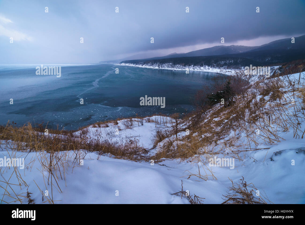 Bay of the Okhotsk sea through gloomy sunset, Sakhalin island Stock ...