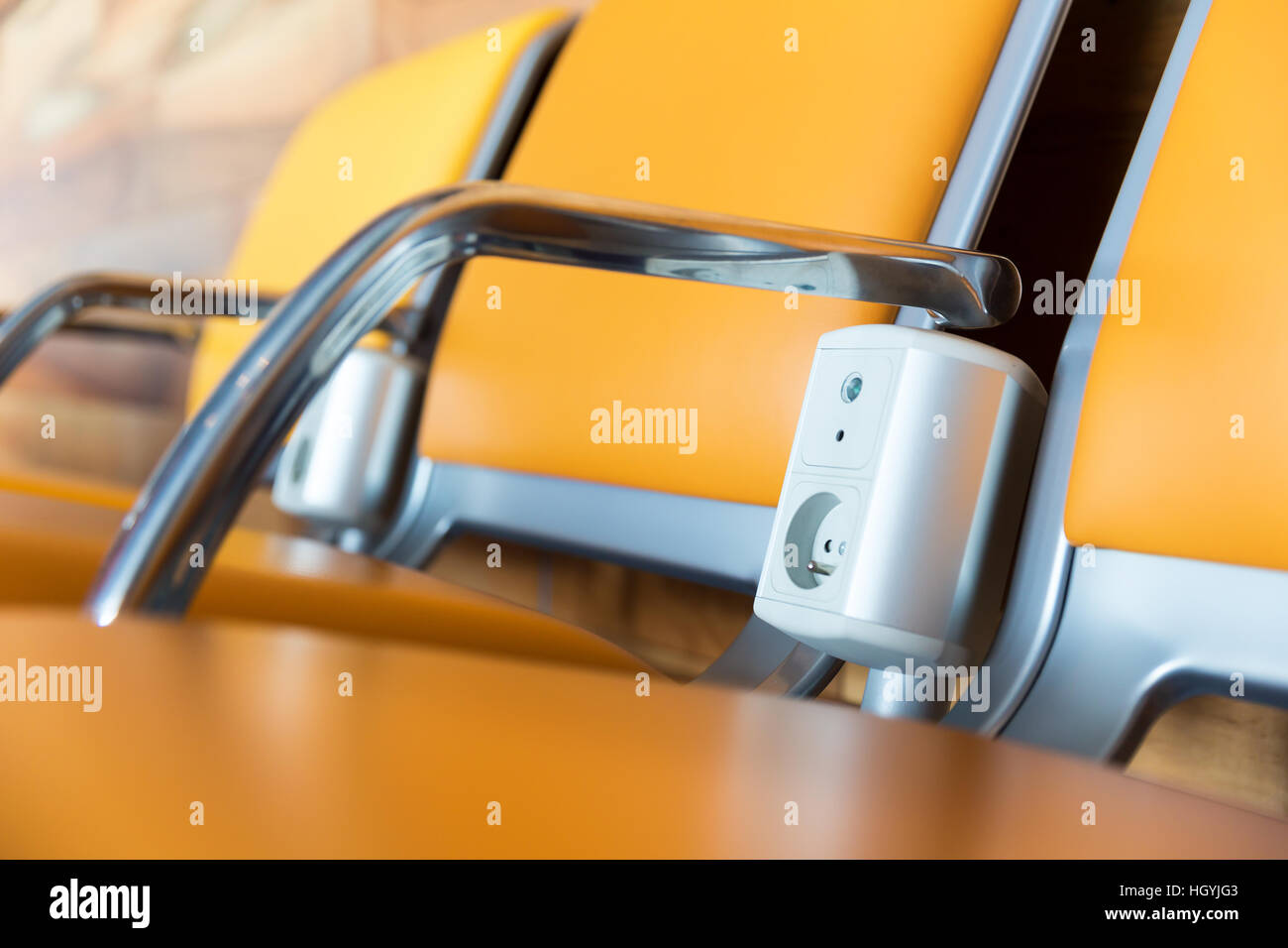 Chairs with electric outlet in airport Stock Photo - Alamy