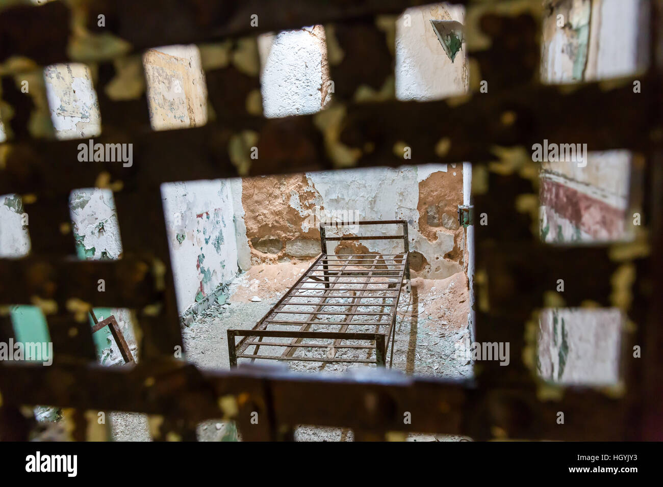 Metal bar door and cell in a prison Stock Photo - Alamy