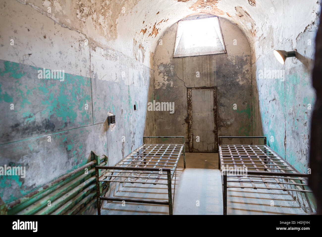 Grunge prison cell with sunlight window Stock Photo - Alamy