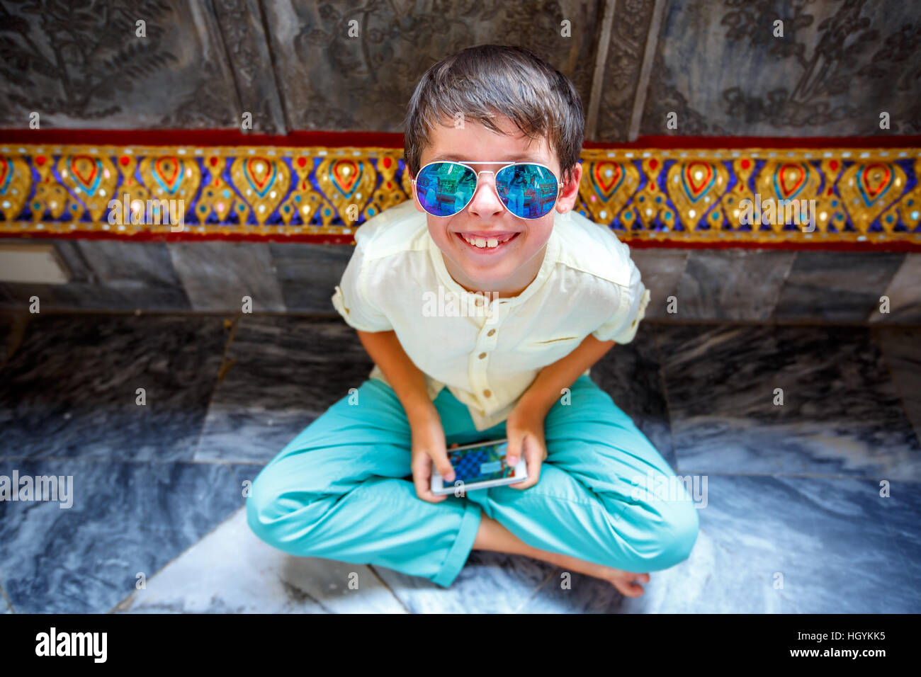 Cute little boy having rest in Grand Palace, Bangkok Stock Photo - Alamy
