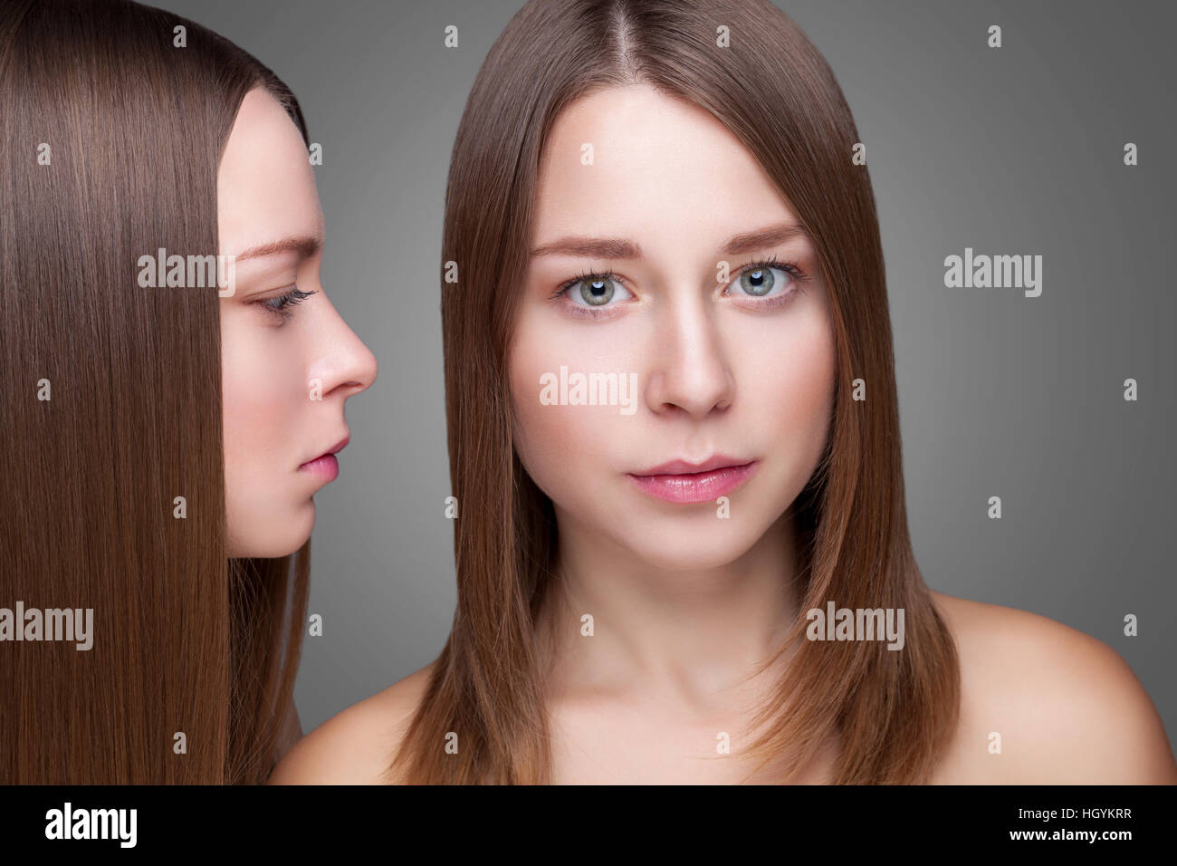 Portrait of twins with perfect skin and long straight hair Stock Photo ...