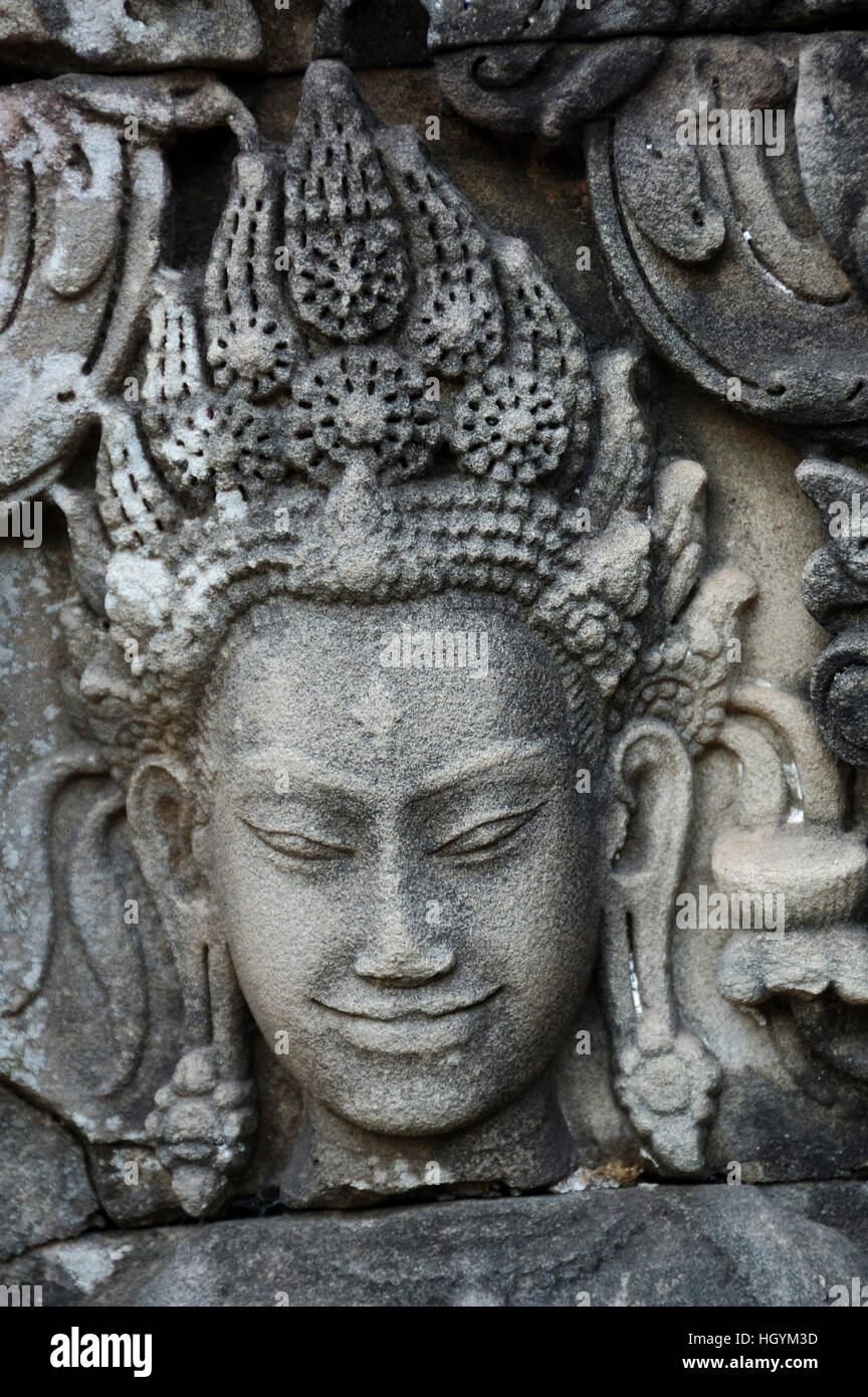 Stone carving of a female face, Apsara, celestial nymphs, Bayon Temple ...