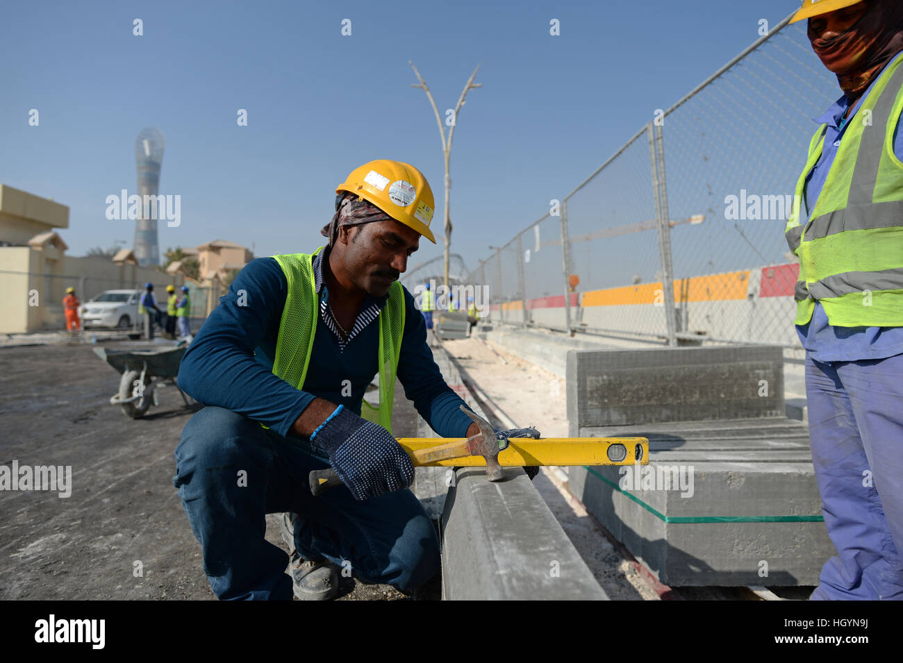 Qatar stadium workers hi-res stock photography and images - Alamy