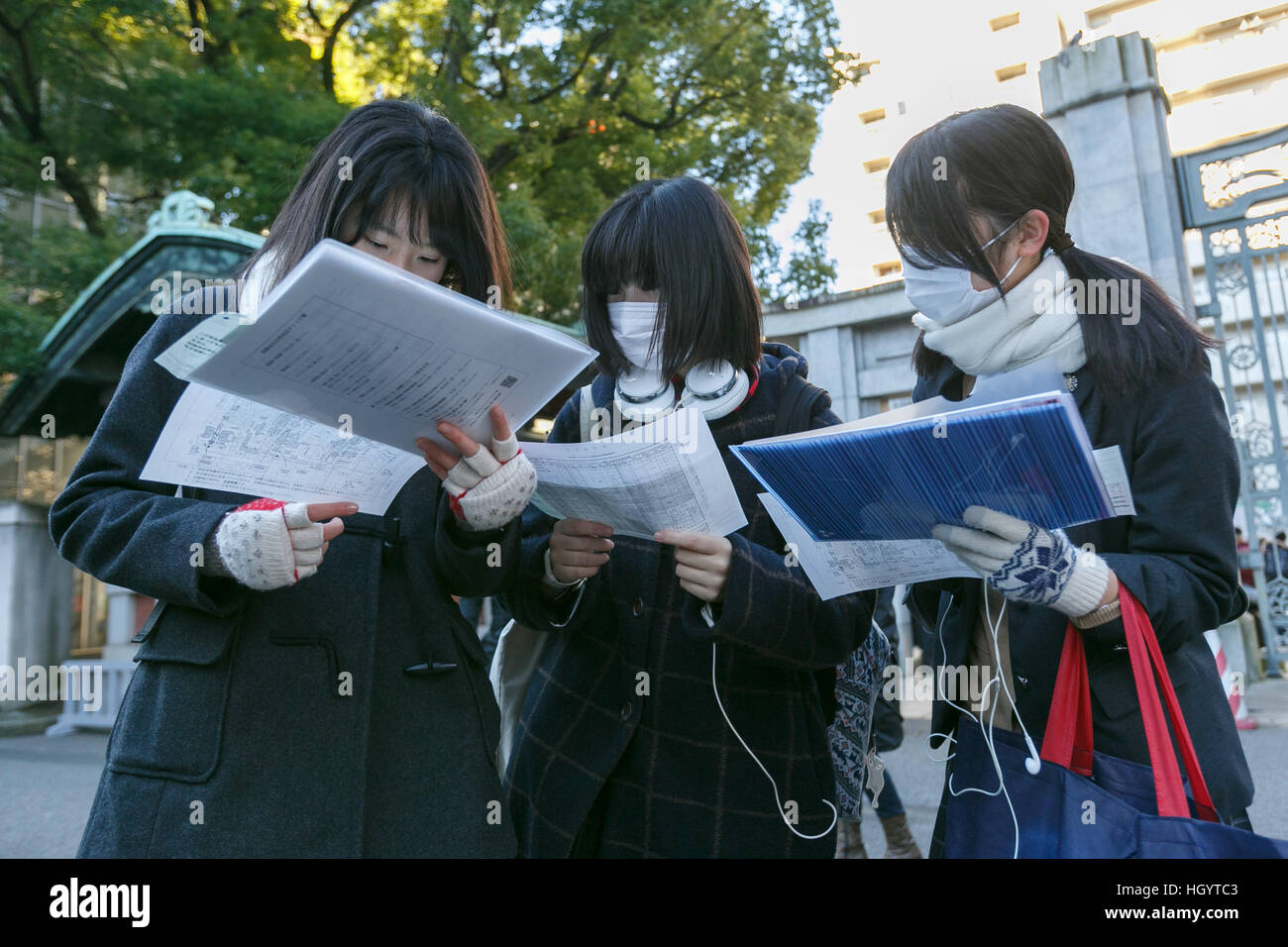 Tokyo, Japan. 14th Jan, 2017. Japanese students check their papers for ...