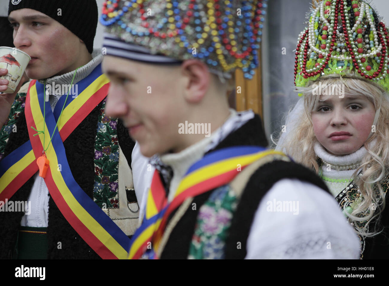 Krasnoilsk, Ukraine. 14th Jan, 2017. Locals wearing costumes walk from ...