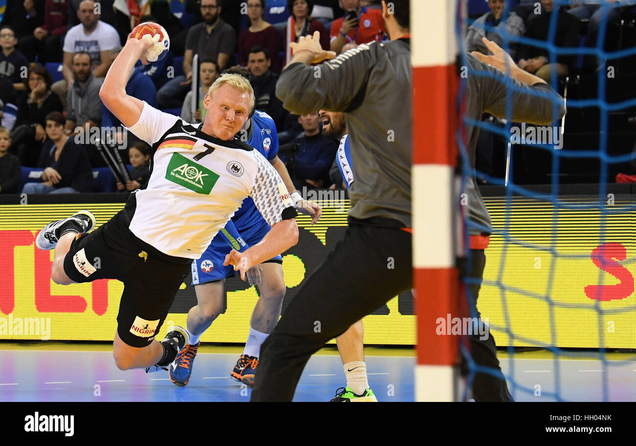 Rouen, France. 15th Jan, 2017. Germany's Patrick Wiencek (l) in action ...