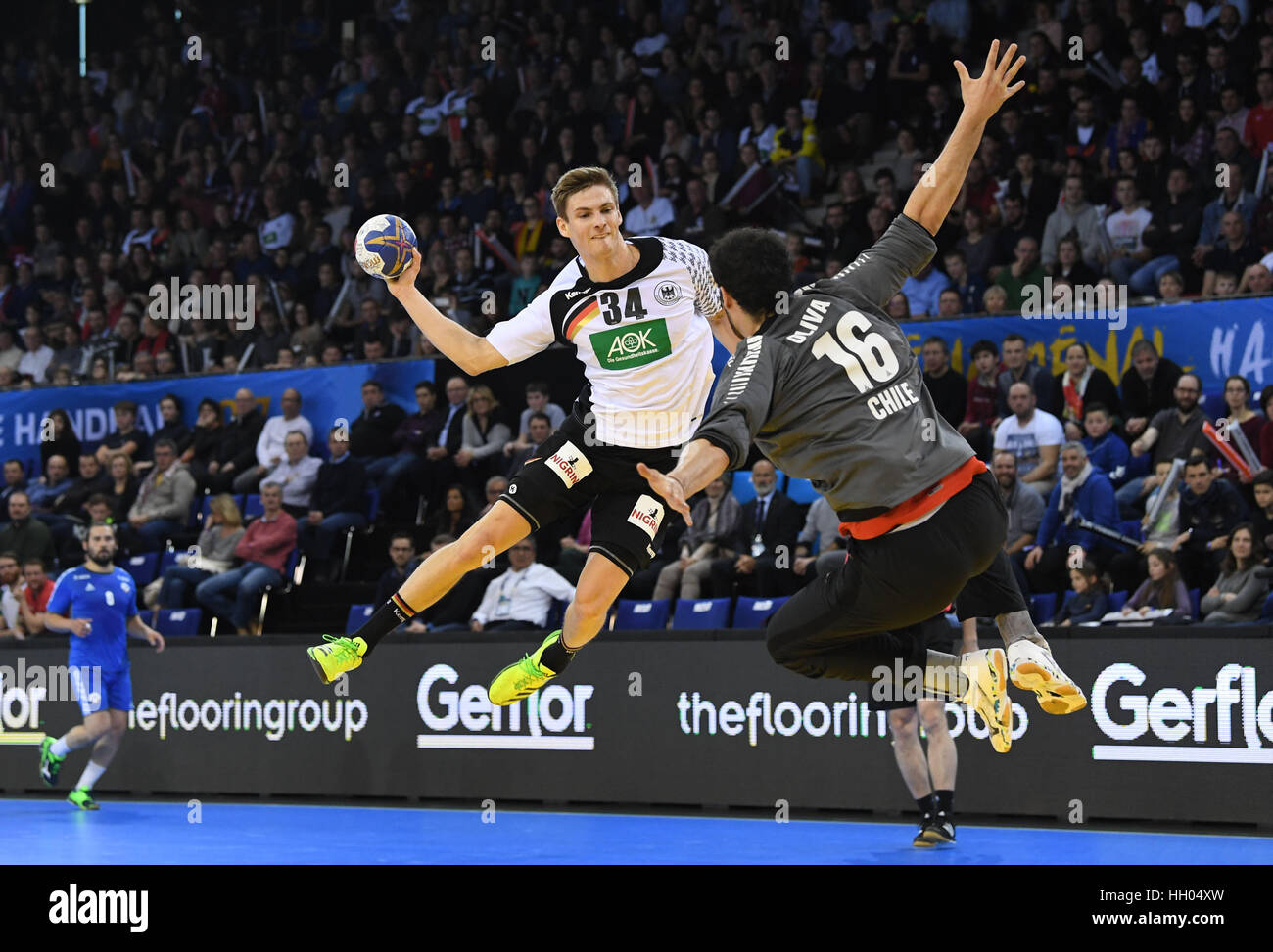 Rouen, France. 15th Jan, 2017. Germany's Rune Dahmke (l) and Chile's ...