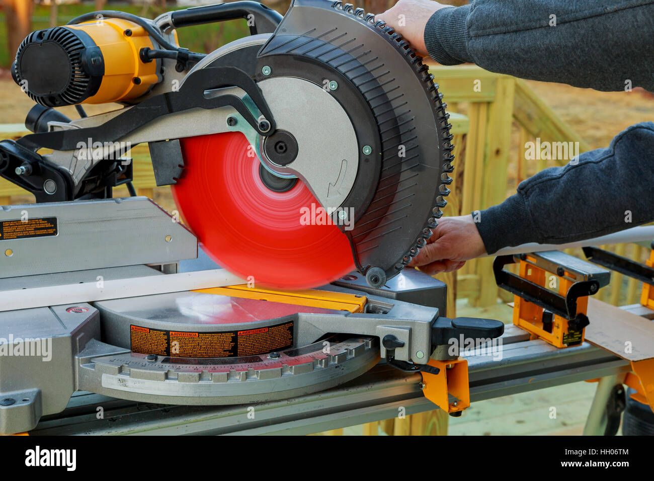 man cutting wood on electric saw Saws for cutting trees Stock Photo - Alamy