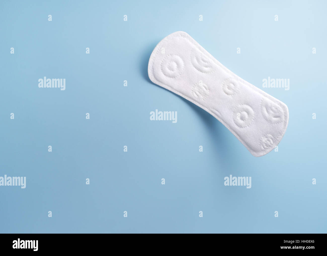 close up view of woman's sanitary pad on color back Stock Photo - Alamy