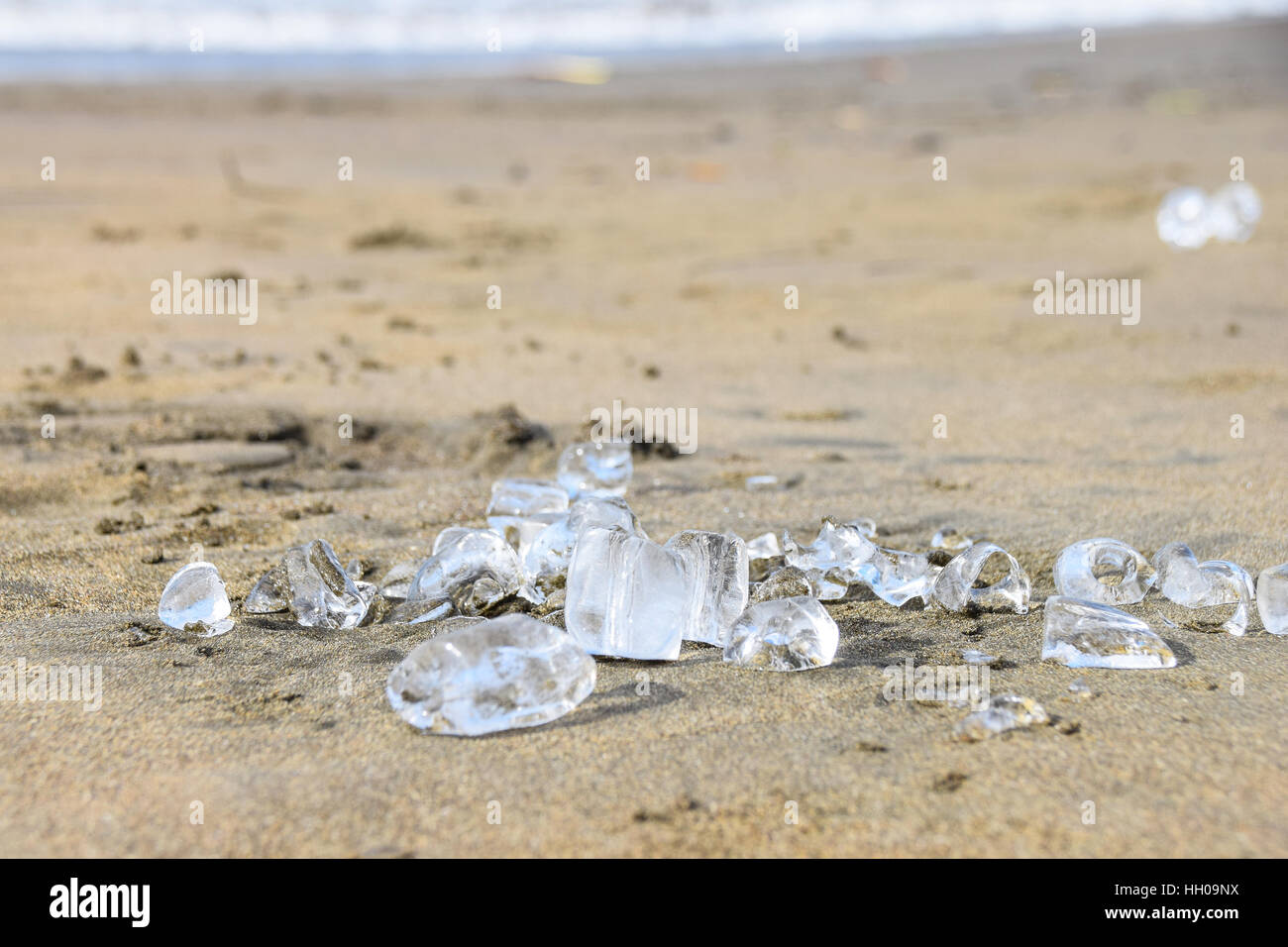 Ice cubes on a sandy beach Stock Photo - Alamy
