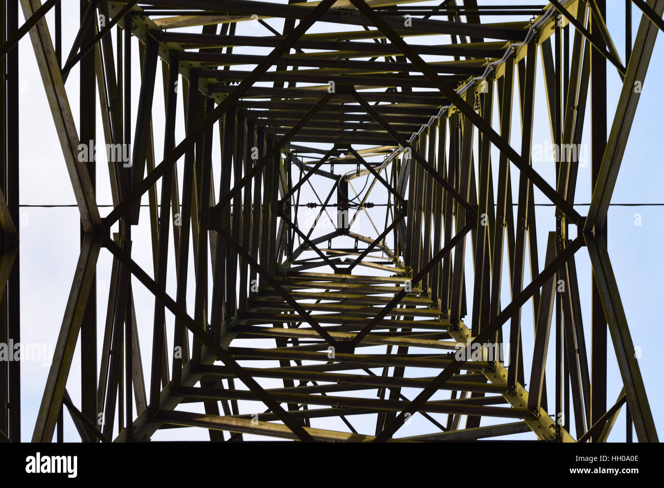 Looking up into the centre of electricity pylons Stock Photo - Alamy