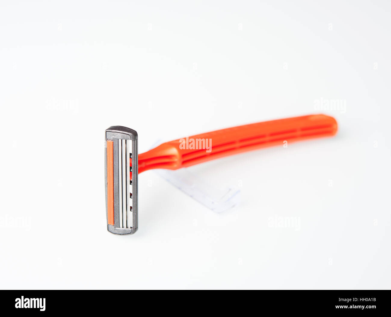 orange razor on the table Stock Photo - Alamy