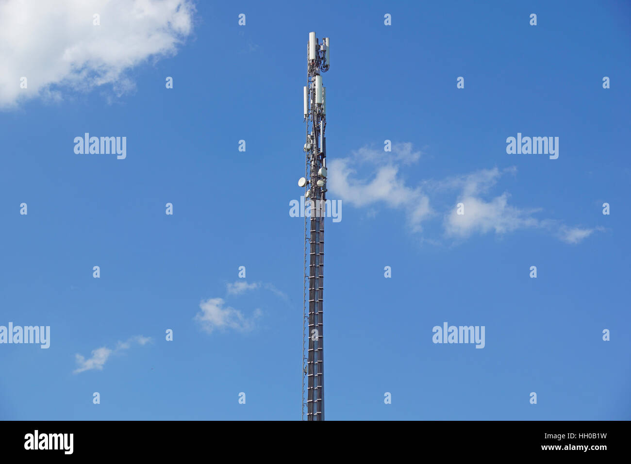 structure tower of cell phone antenna with blue sky Stock Photo - Alamy