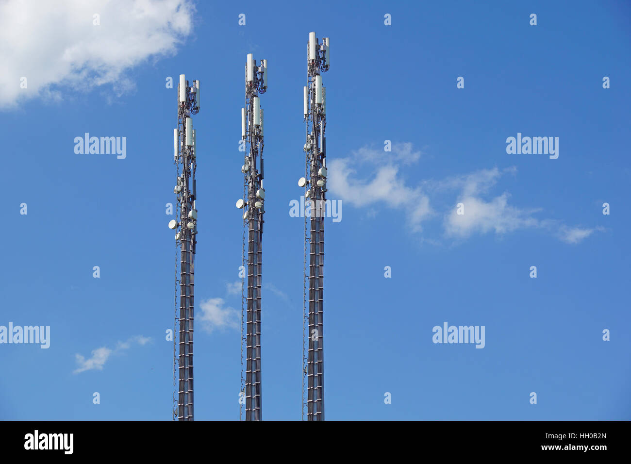 structure tower of cell phone antenna with blue sky Stock Photo - Alamy