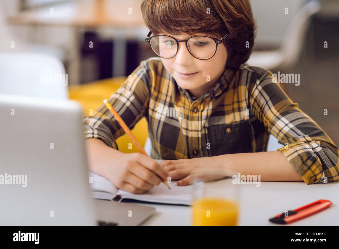 Little man-child doing hometask Stock Photo - Alamy