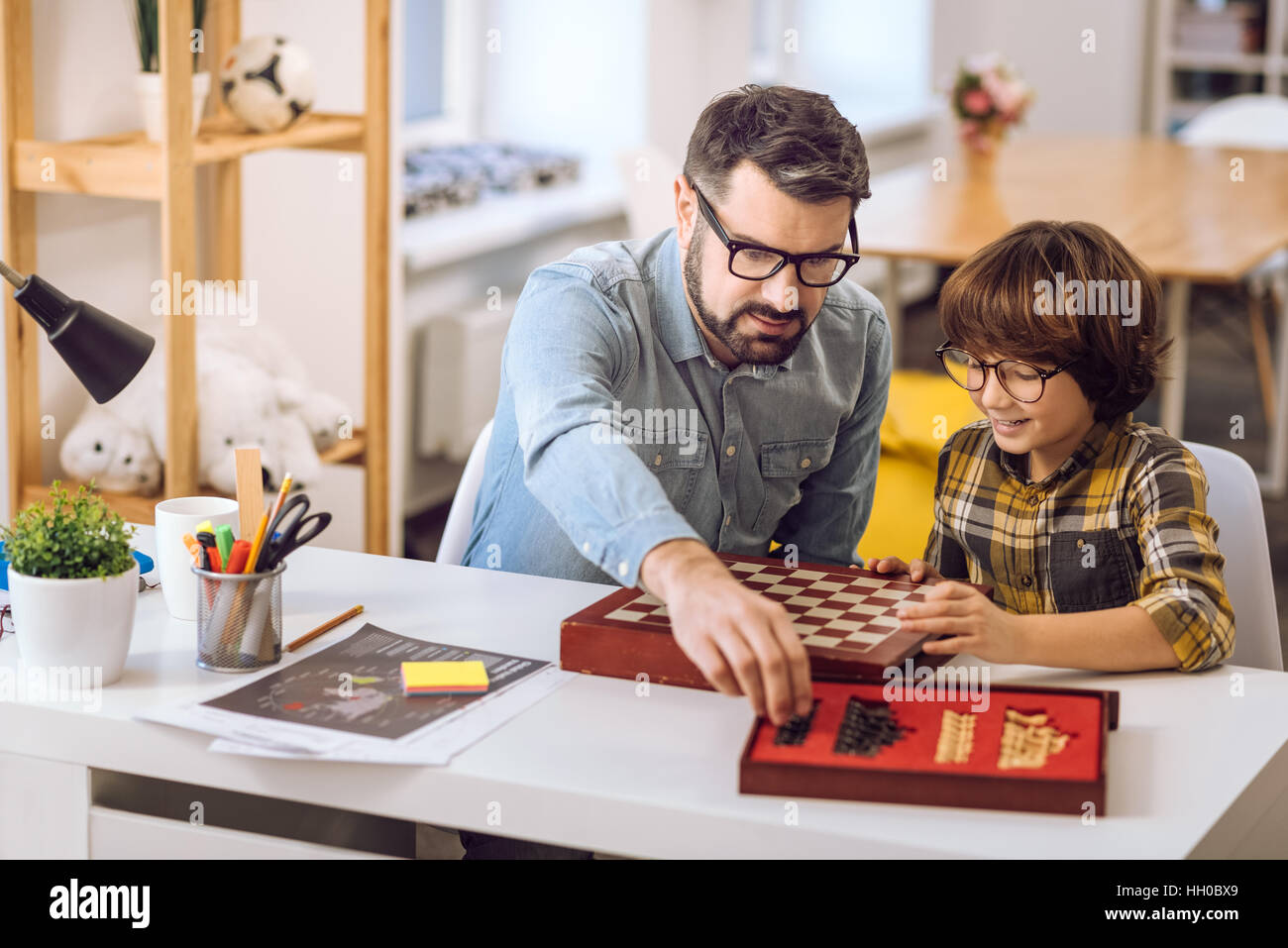 Attentive father preparing for game Stock Photo - Alamy