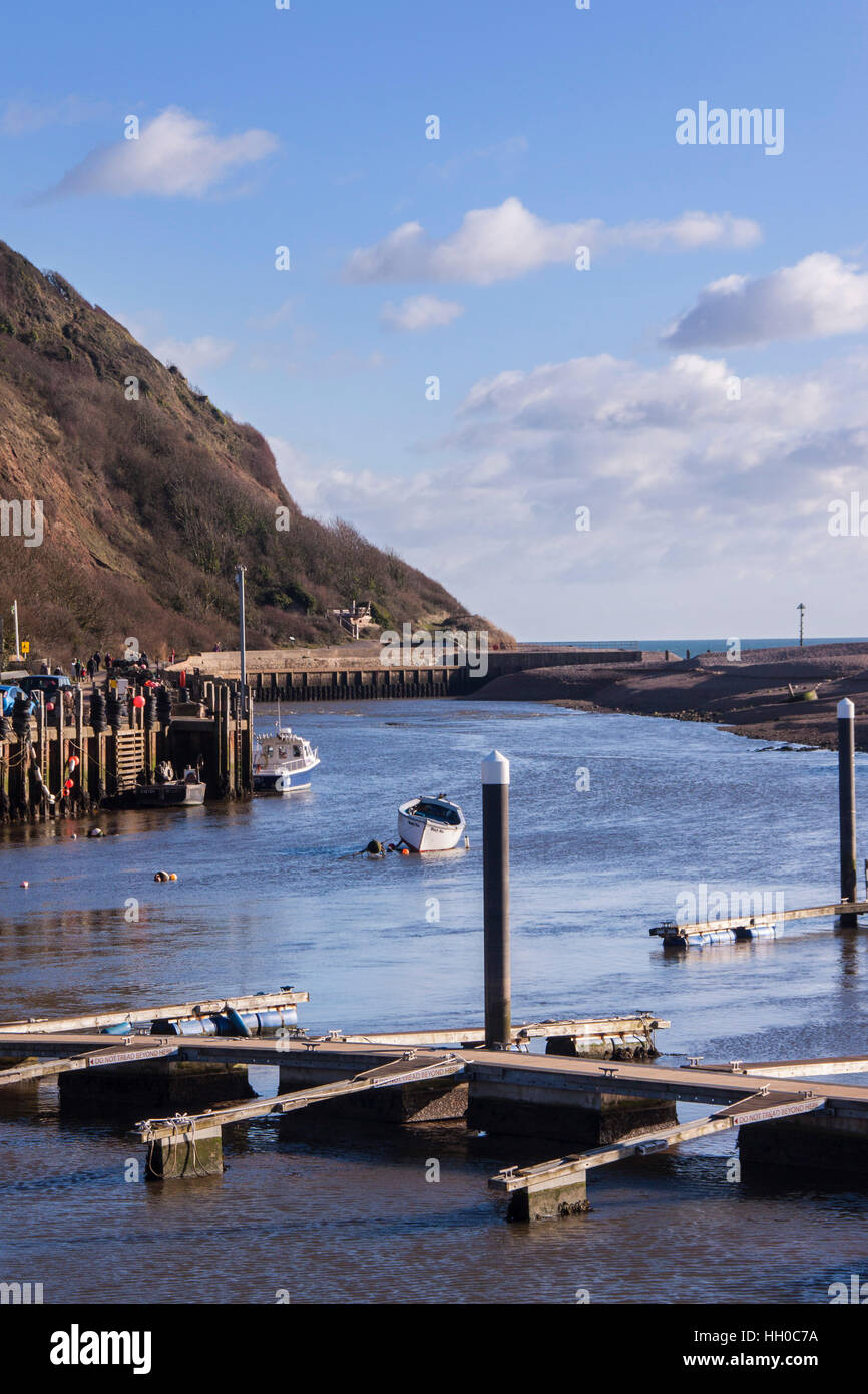 Axmouth Harbour, looking out to sea along the Axe River from besides ...
