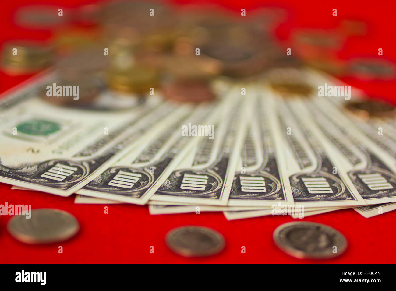 Money on red background closeup Stock Photo - Alamy