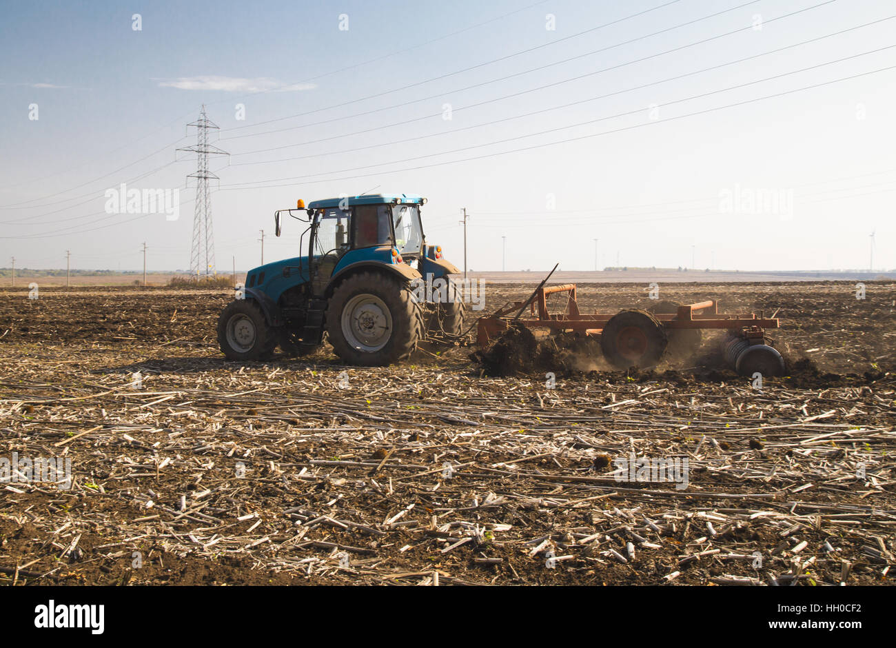 Farmer in tractor preparing land for sowing Stock Photo - Alamy