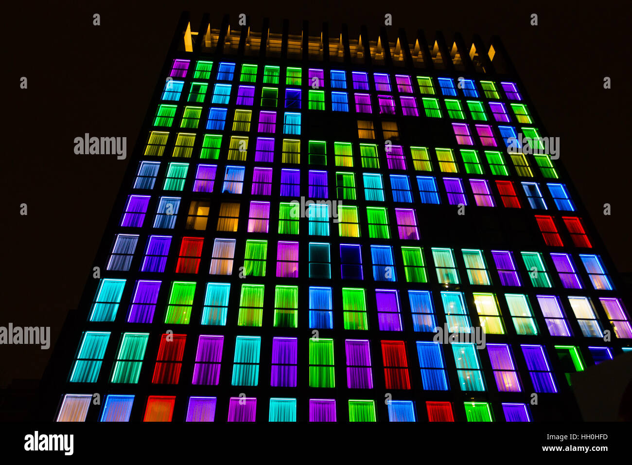 Colored windows texture. Windows illuminated by neon lights background ...