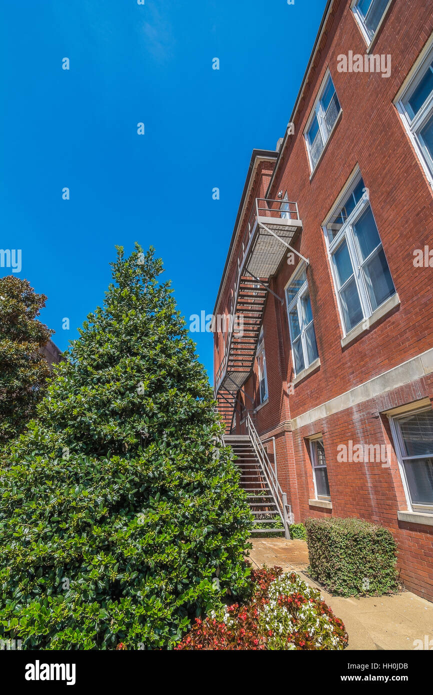 Shrubs and Brick Architecture Stock Photo - Alamy