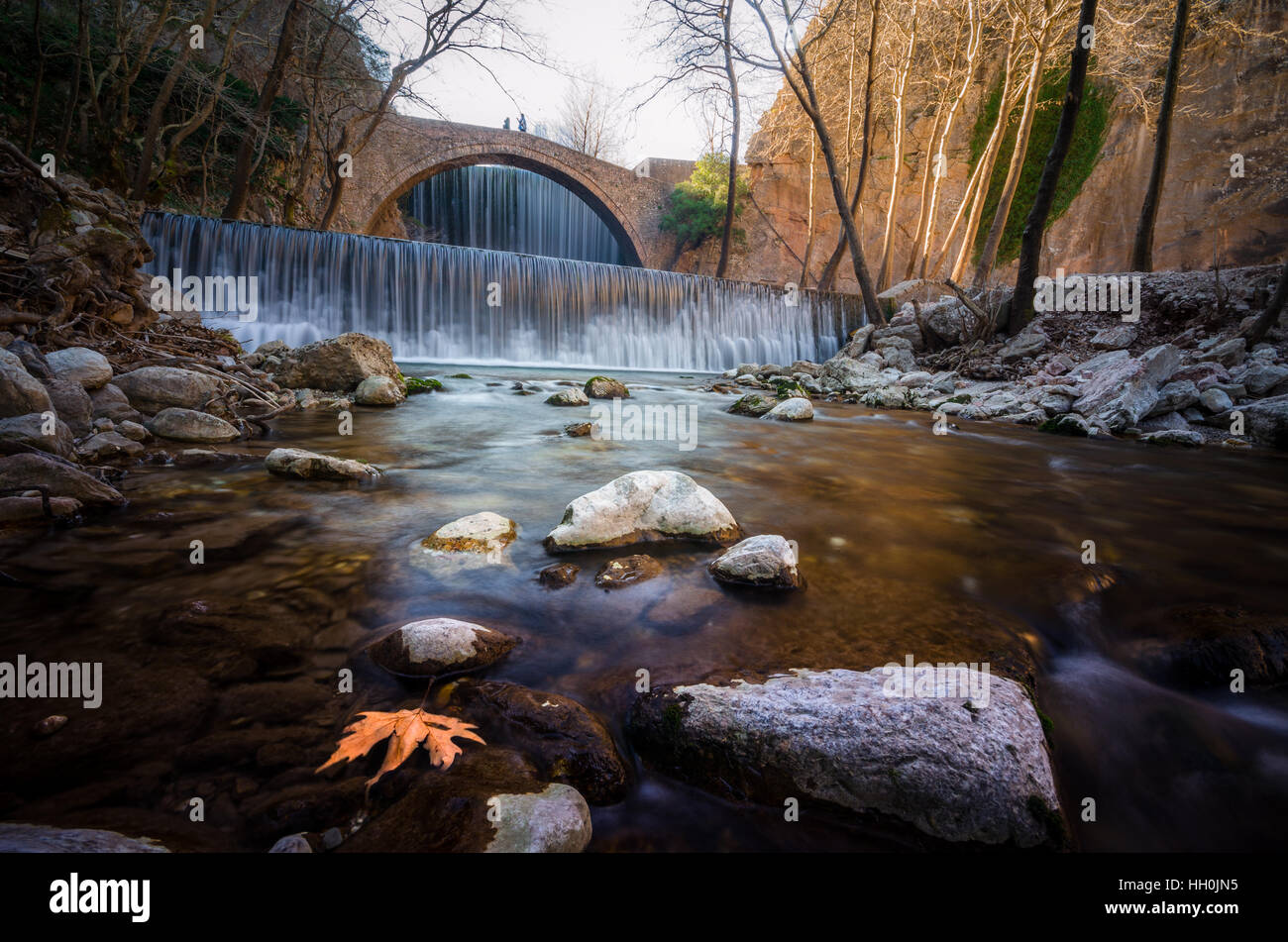 Paleokarya, old, stone, arched bridge, between two waterfalls. Trikala ...