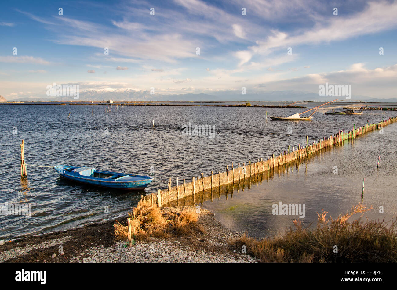 Beautiful sunset landscape with boats at the lagoon of Mesolongi ...
