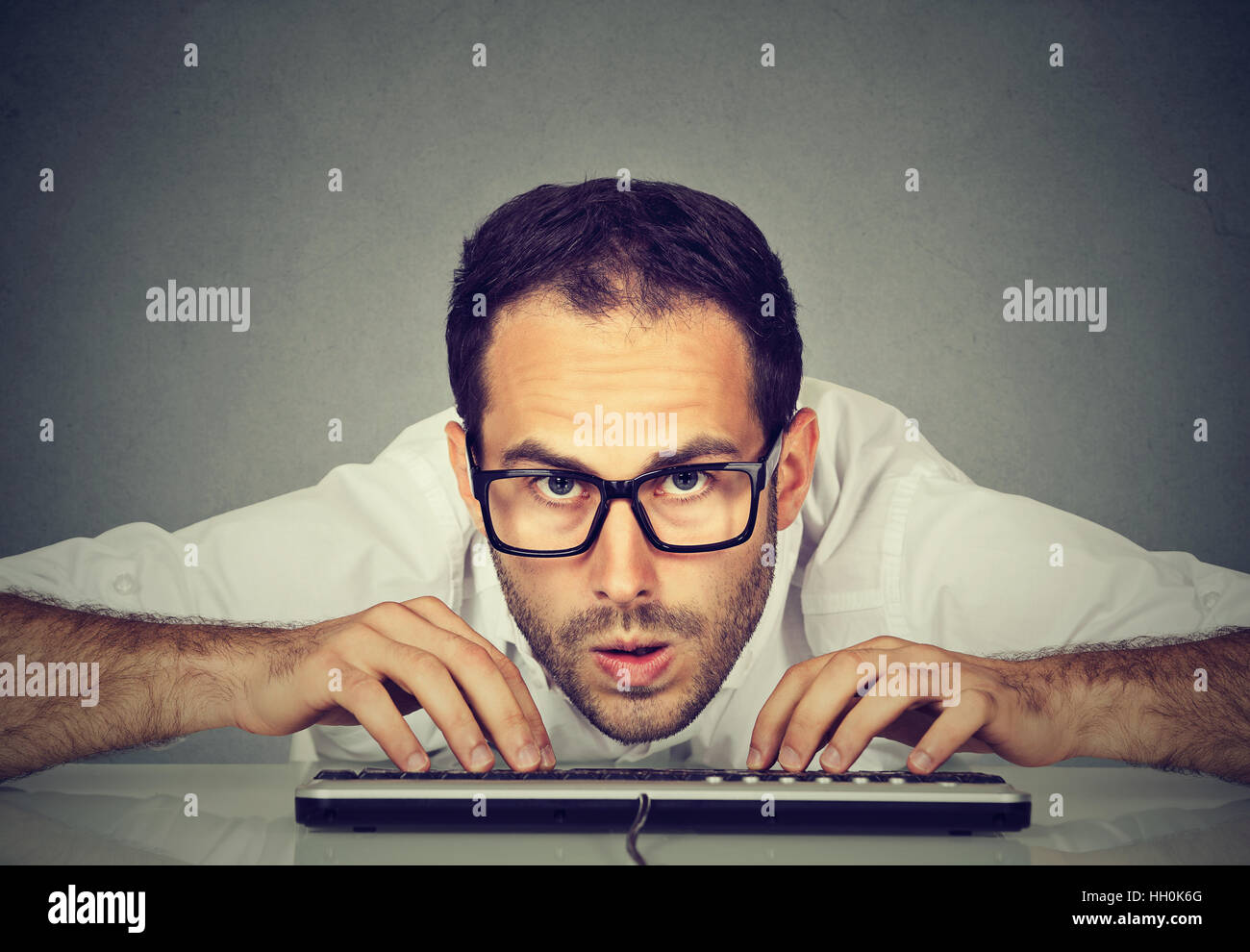 Computer geek typing on keyboard hi-res stock photography and images ...