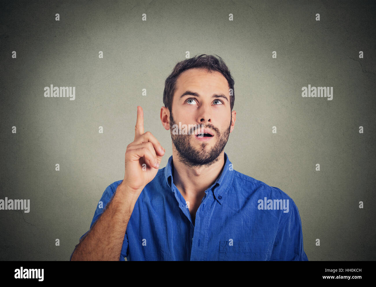 Handsome guy pointing finger up hi-res stock photography and images - Alamy