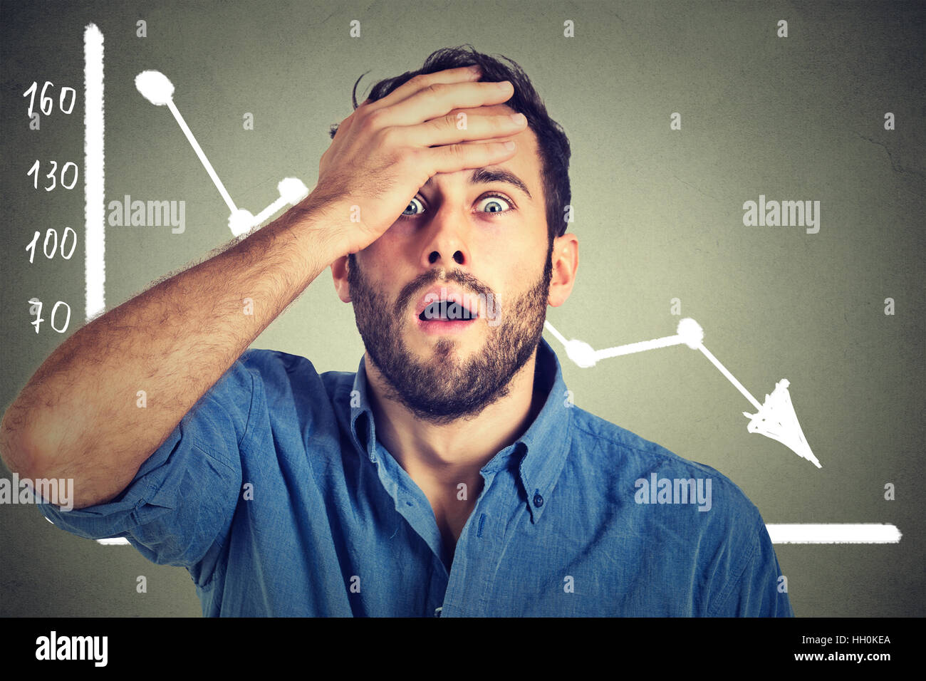 Frustrated stressed shocked business man with financial market chart ...