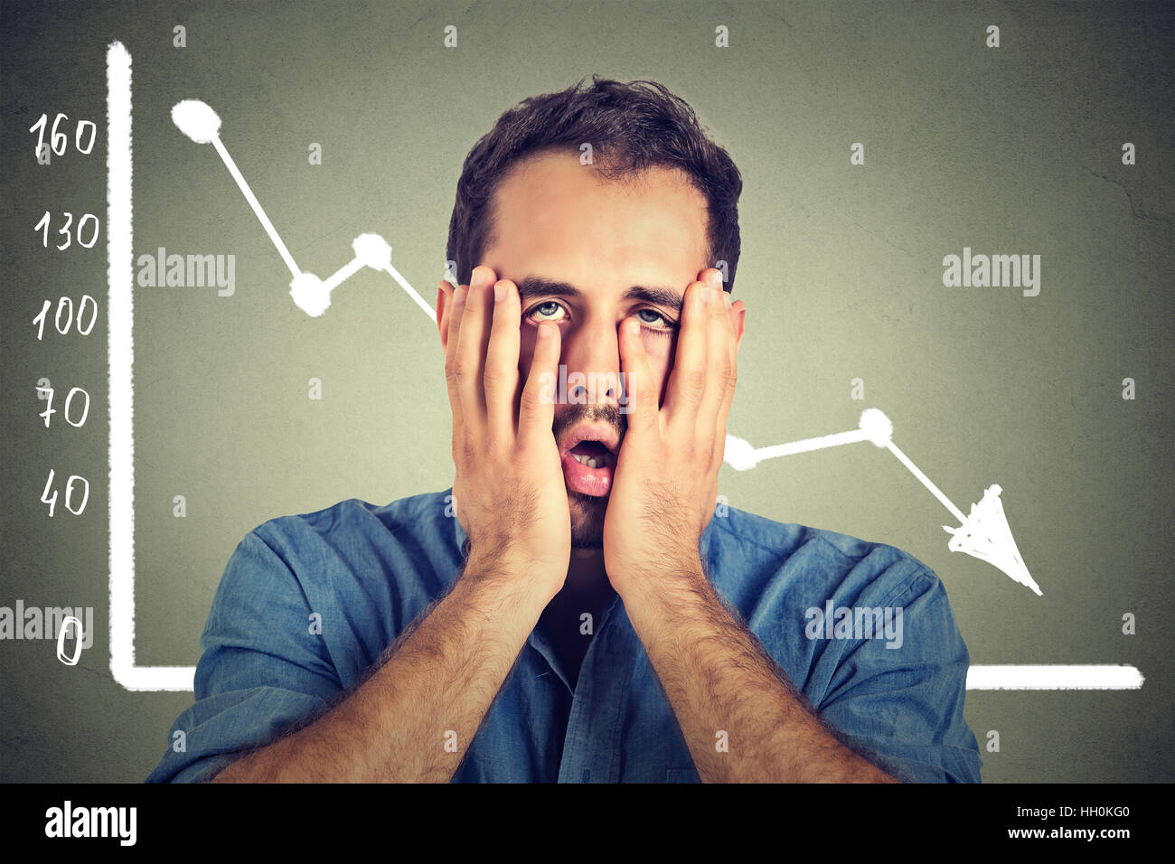 Frustrated stressed man desperate with financial market chart graphic ...