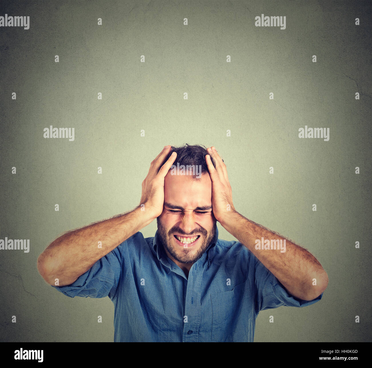 stressed man upset frustrated isolated on gray wall background ...