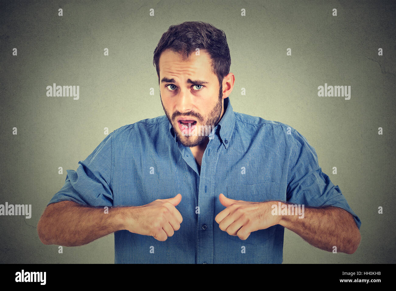 angry, mad young guy pointing at himself you mean me talking to me ...