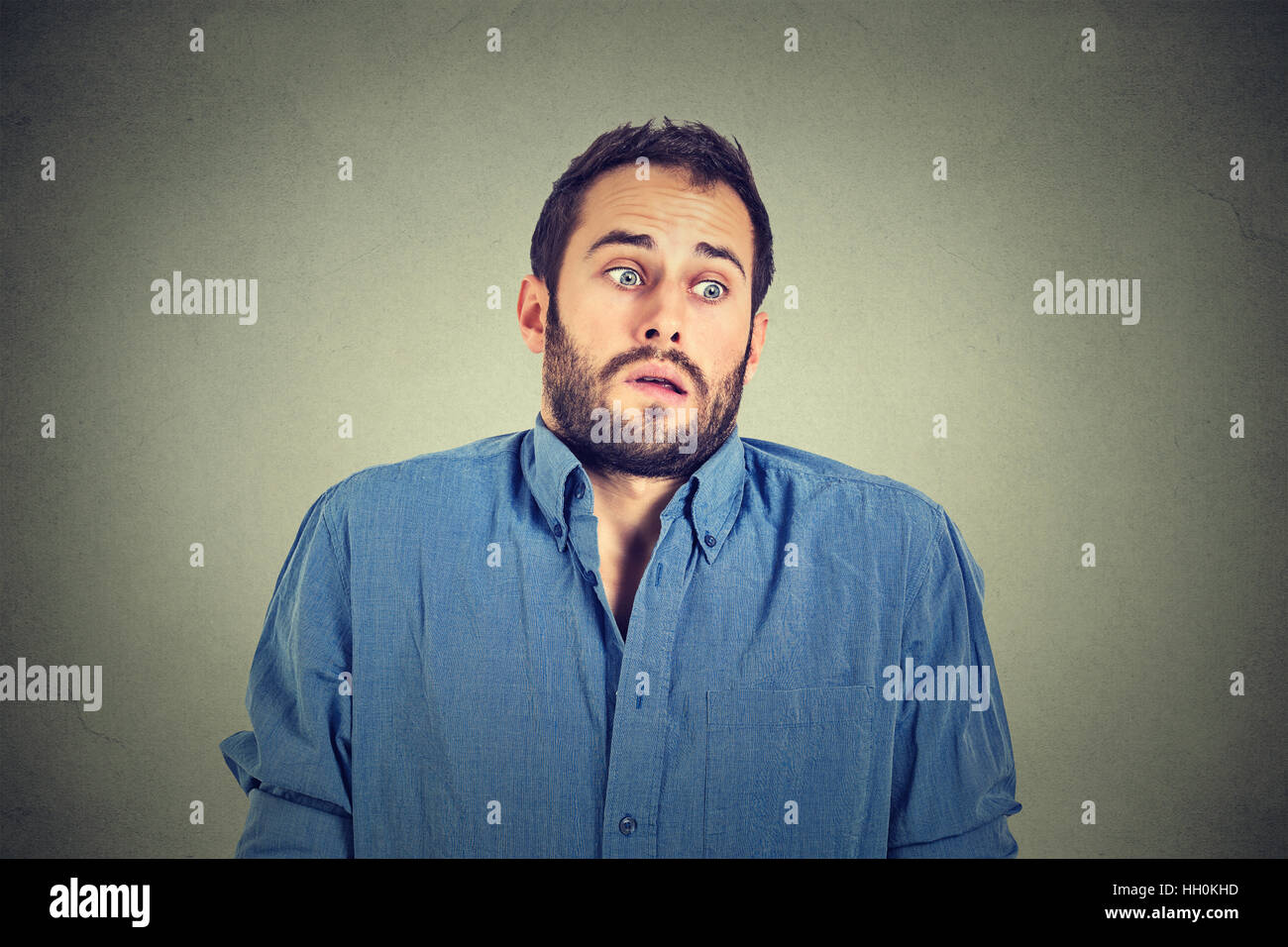 young man shrugging shoulders who cares so what I don't know gesture ...