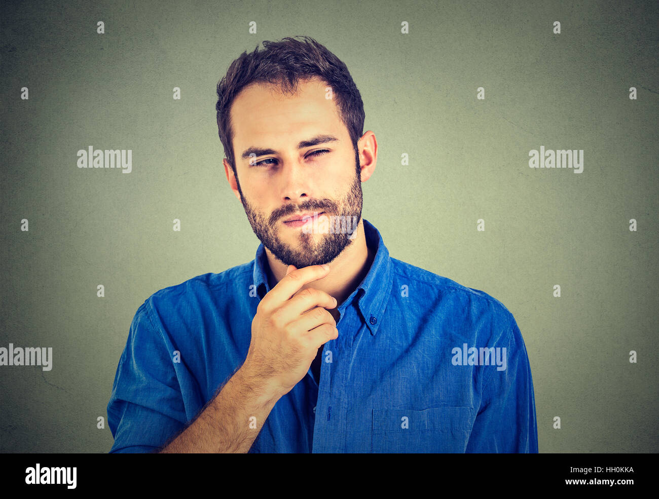 Boy looking suspicious hi-res stock photography and images - Alamy