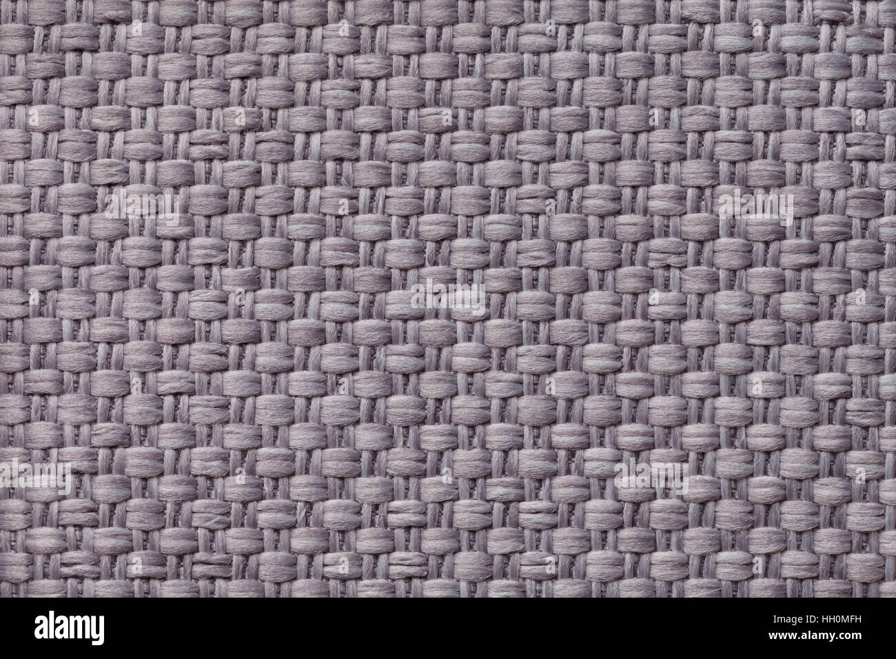 Light gray background with checkered pattern, closeup. Structure of the ...