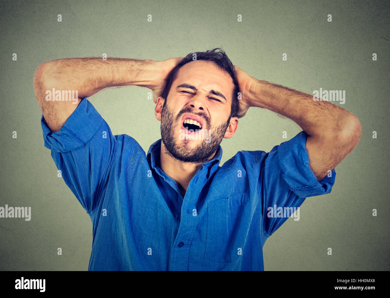 Stressed young man Stock Photo - Alamy