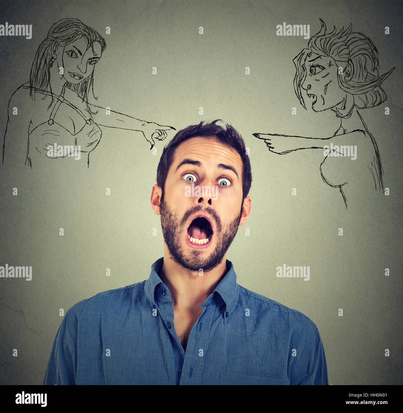 Two angry women blaming shocked scared young man Stock Photo - Alamy