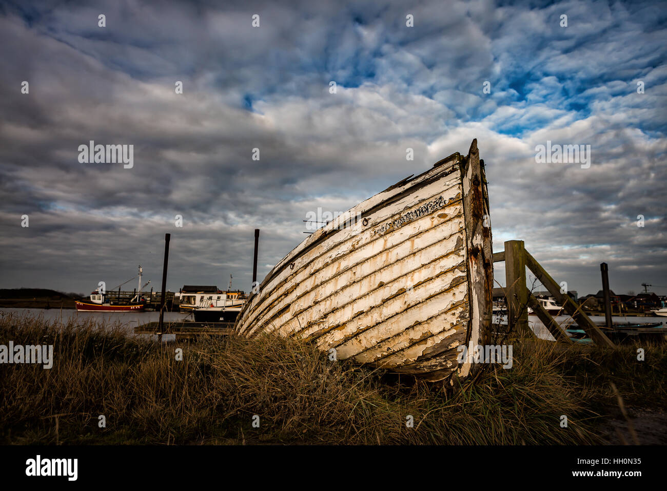 Washed up wooden boat at the coast Stock Photo - Alamy