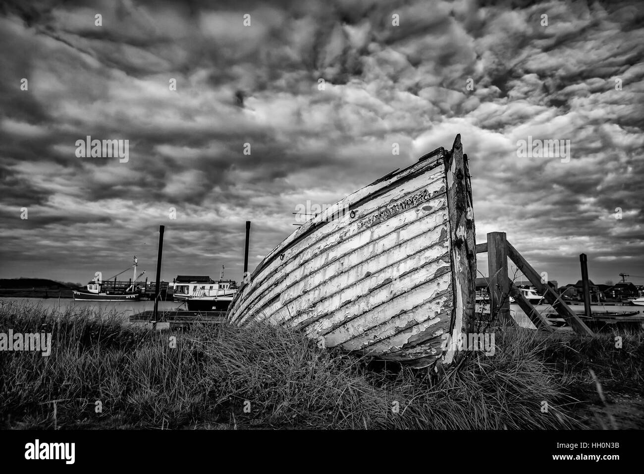 Washed up wooden boat at the coast Stock Photo - Alamy