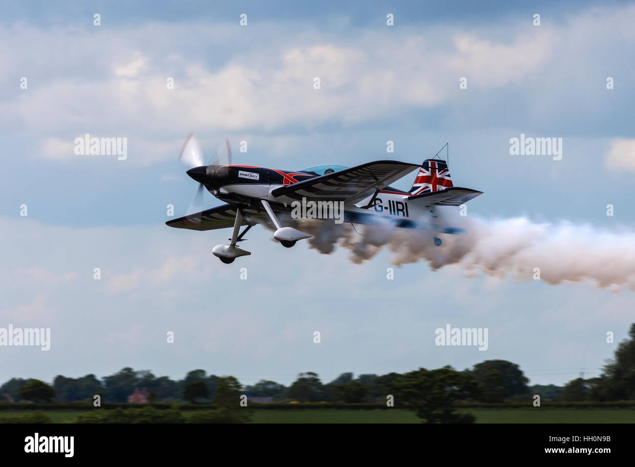Aerobatic airplane trailing smoke hi-res stock photography and images ...