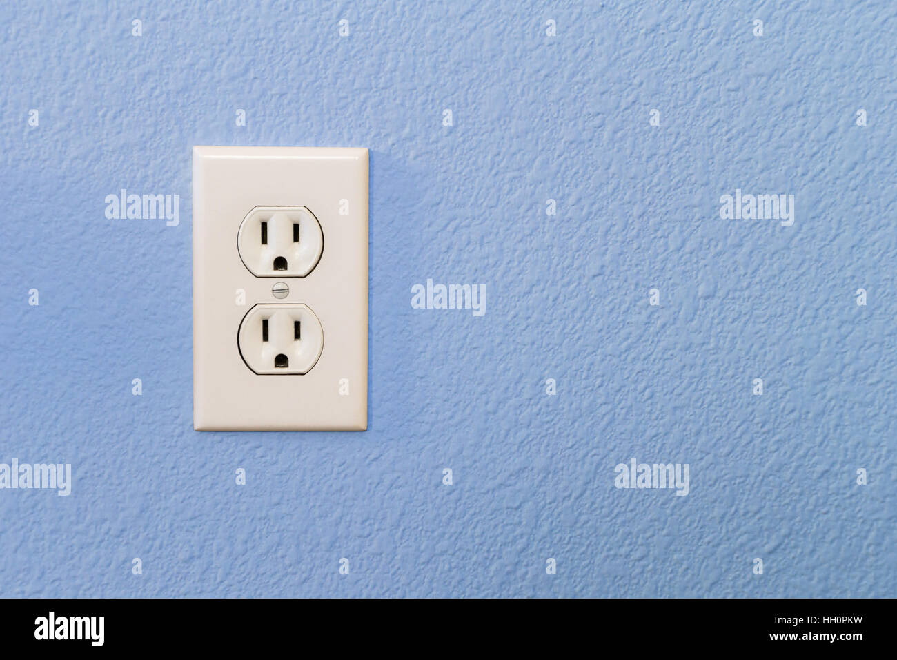 Electrical Sockets In Colorful Blue Wall of House Stock Photo - Alamy