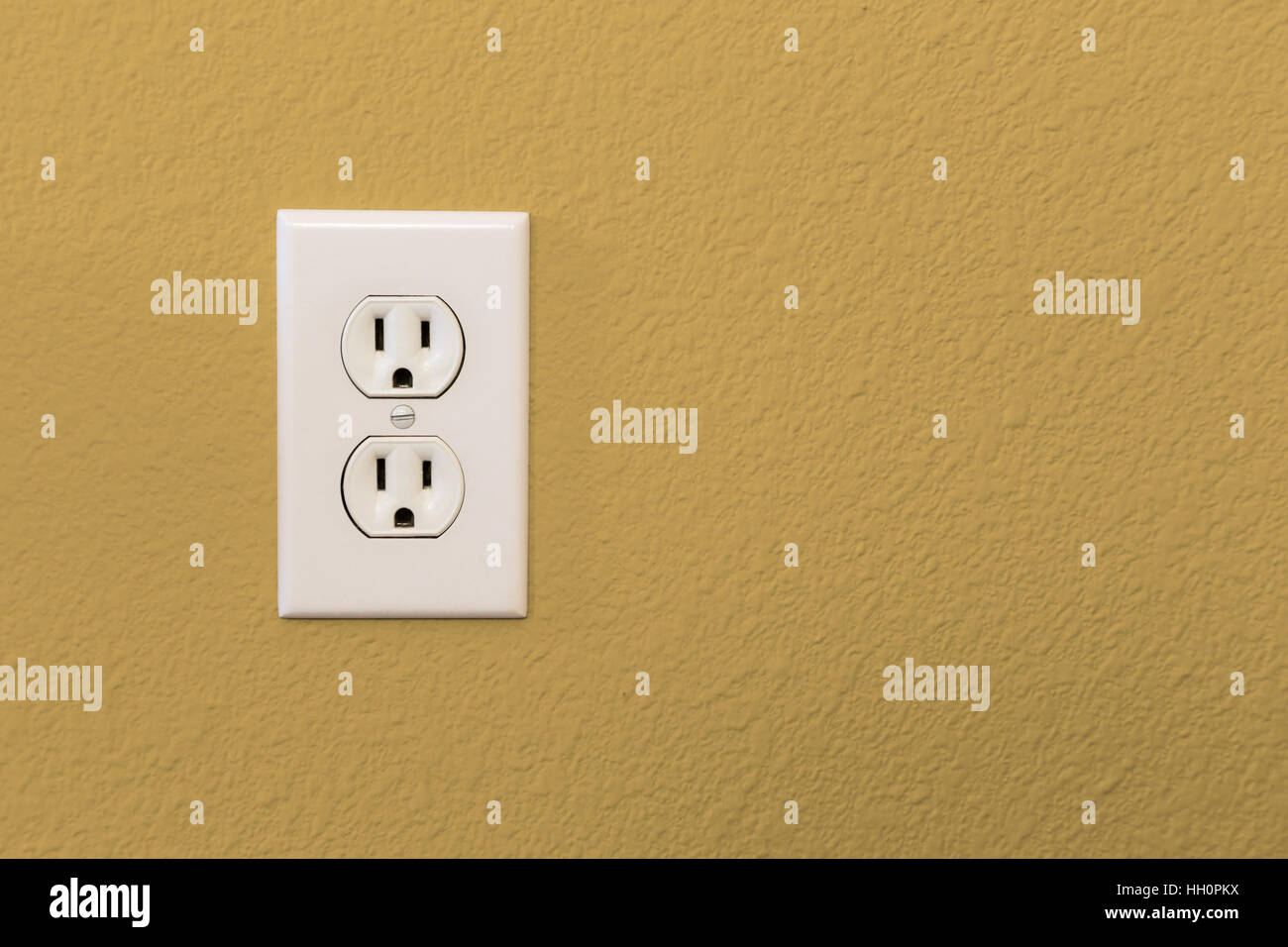 Electrical Sockets In Colorful Mustard Yellow Wall of House Stock Photo ...